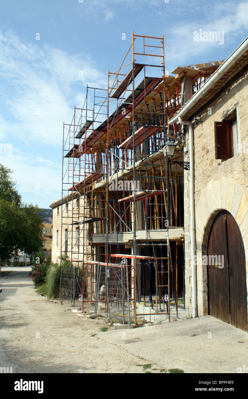 Construction of a house in a village Stock Photo - Alamy