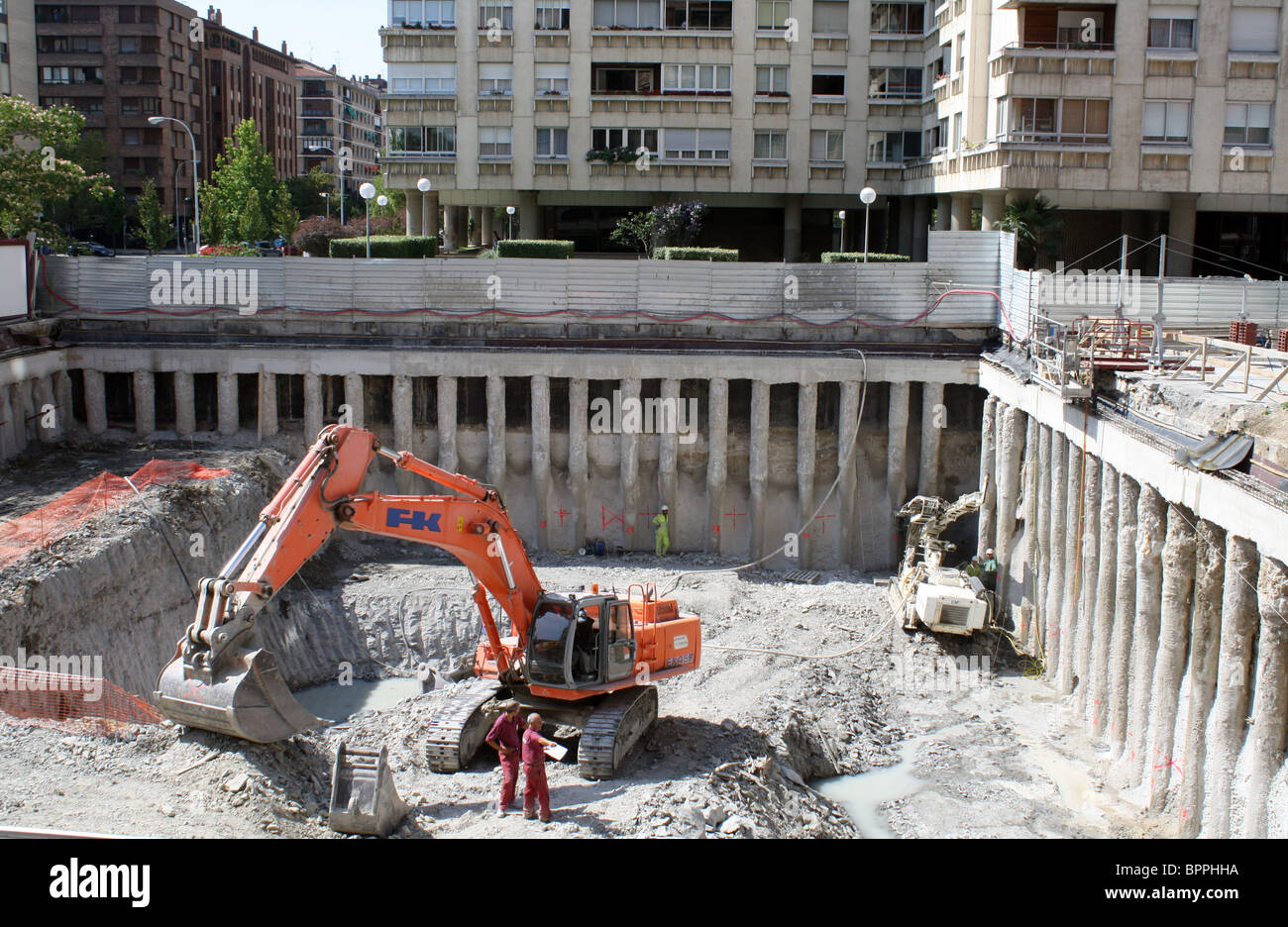 Bulldozer in a construction of a block of flats and offices Stock Photo ...