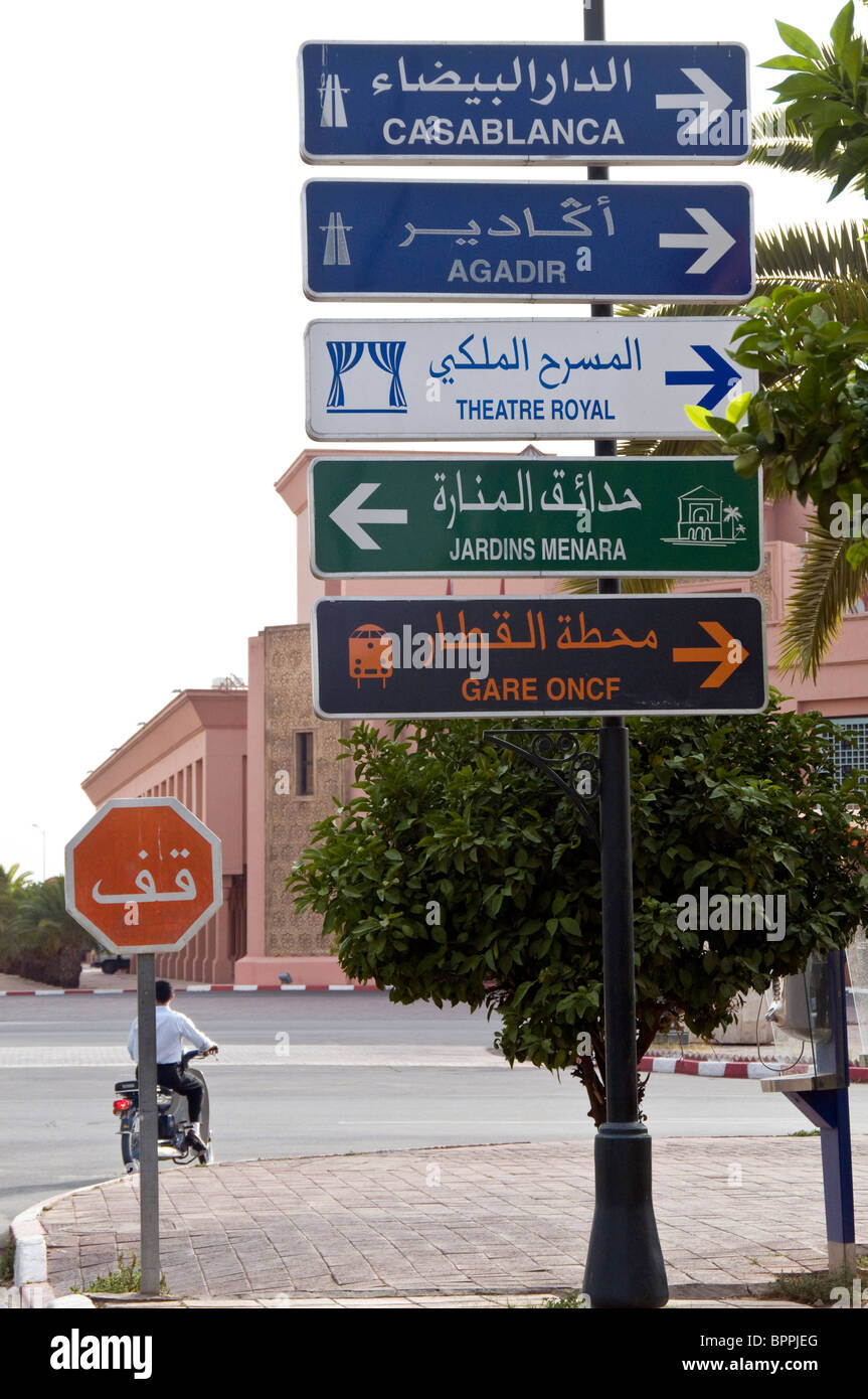 Stop sign and directional sign posts in central Marrakech, Morocco ...