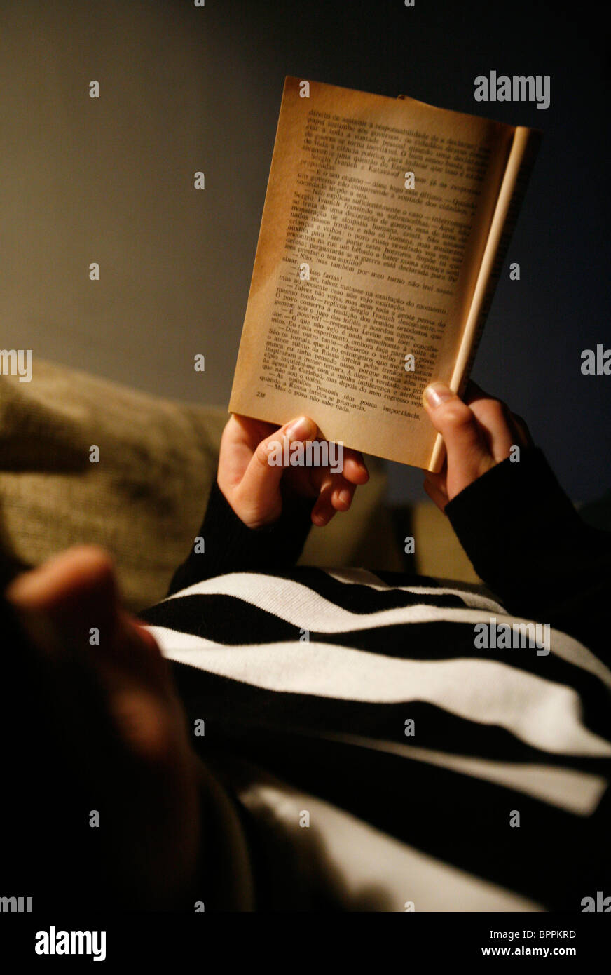 Person reading a book Stock Photo - Alamy