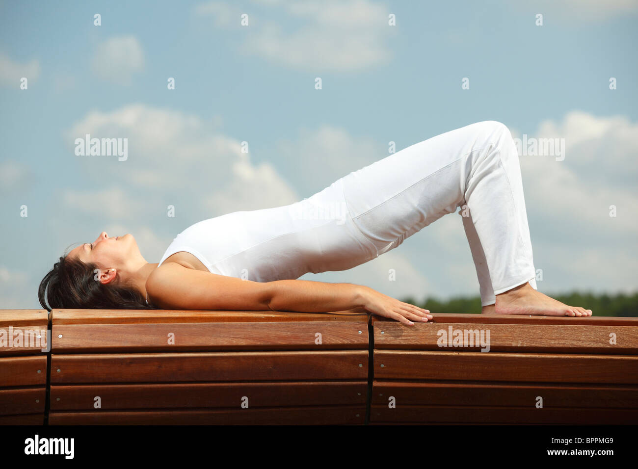Yoga 'bridge pose' / yoga exercise Stock Photo - Alamy