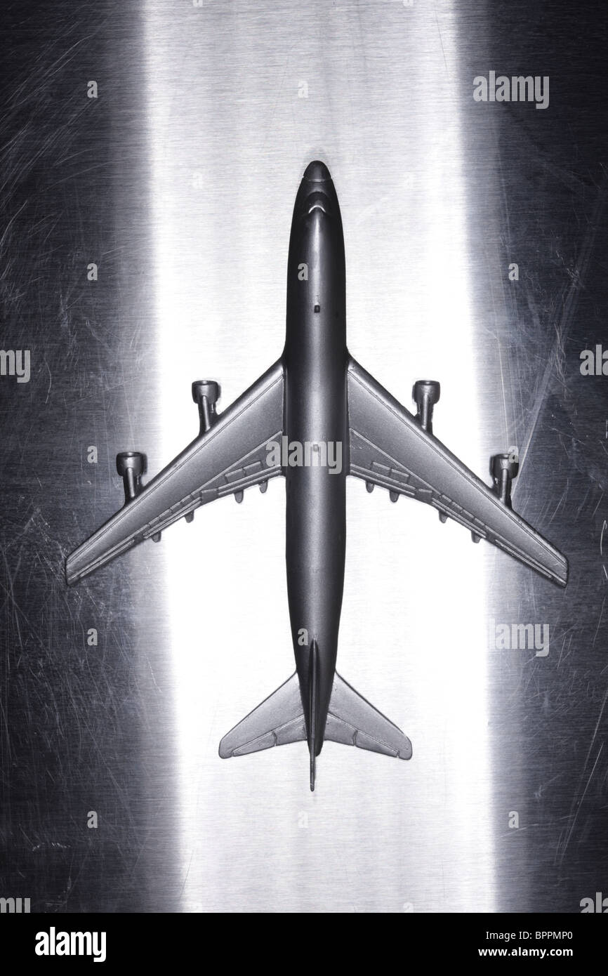 Metal toy airplane on metallic surface Stock Photo - Alamy