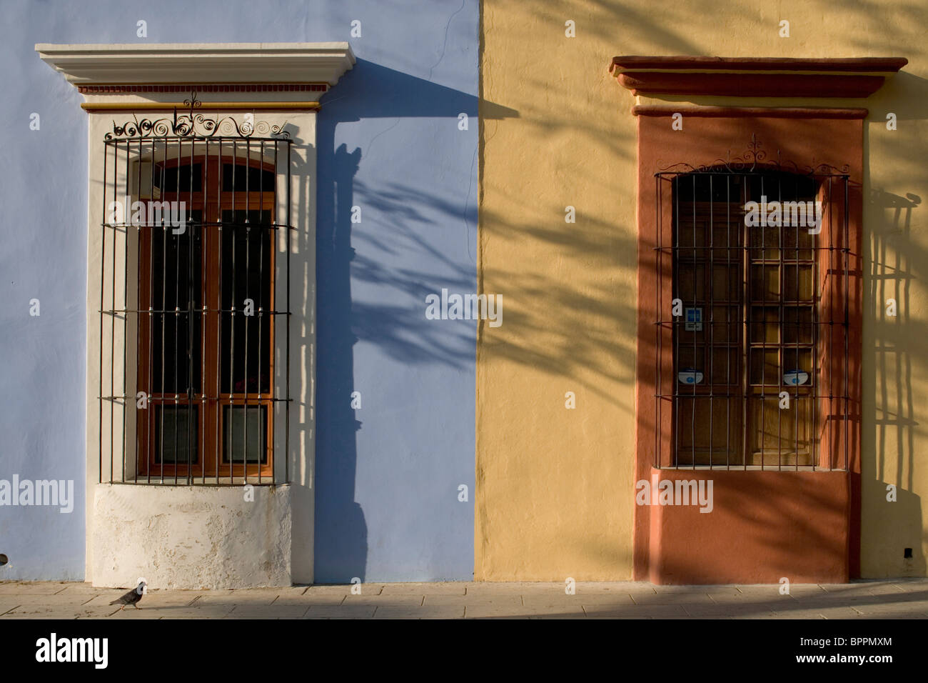 Mexico, Oaxaca, Morning sun lights grated window in restored Spanish ...