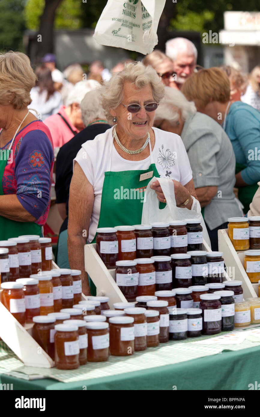 woman selling jam on a stall at Emsworth Flower Show Stock Photo - Alamy
