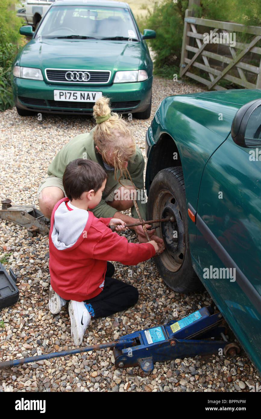 Changing tire helping child hi-res stock photography and images - Alamy