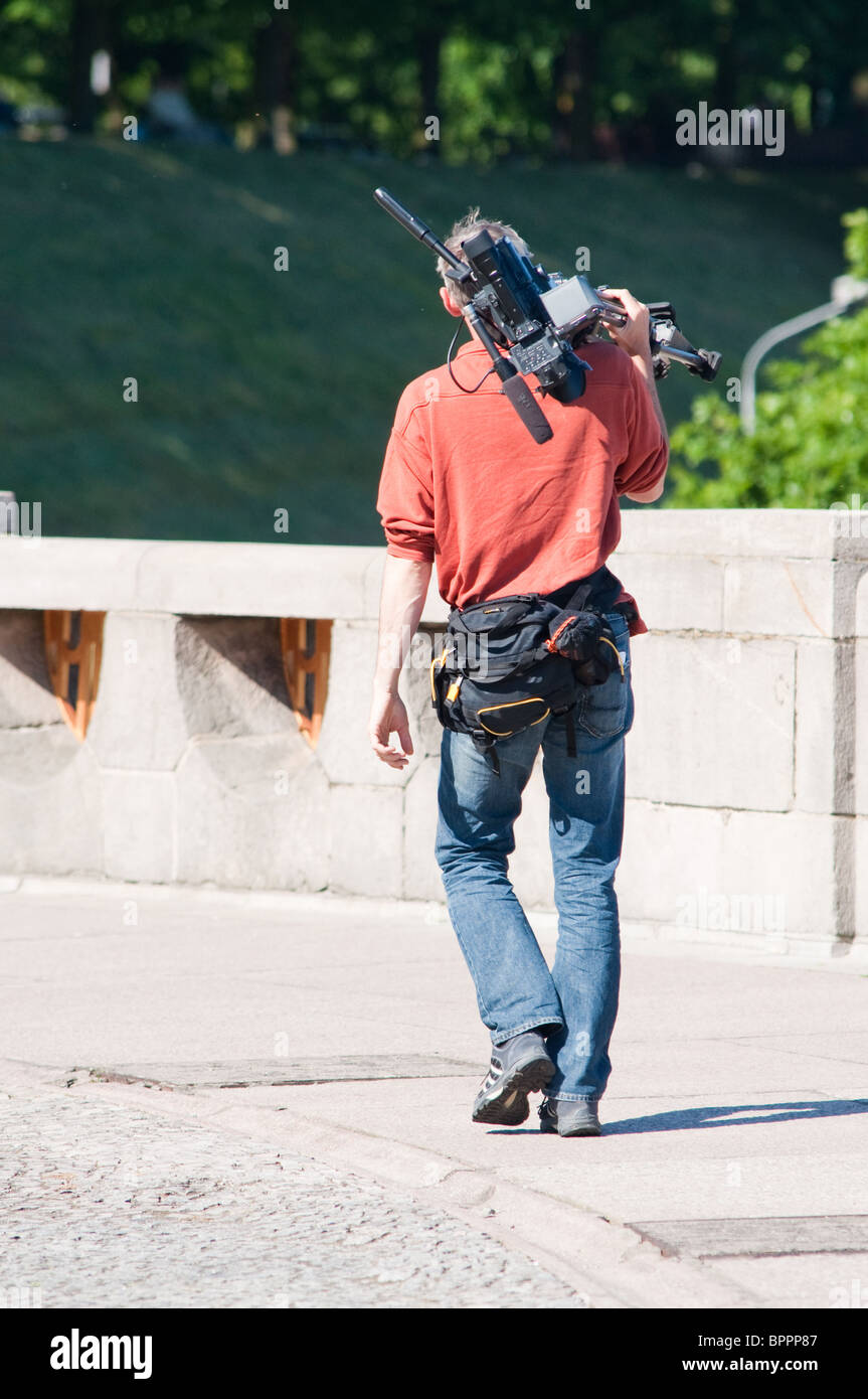 man with the video camera Stock Photo - Alamy