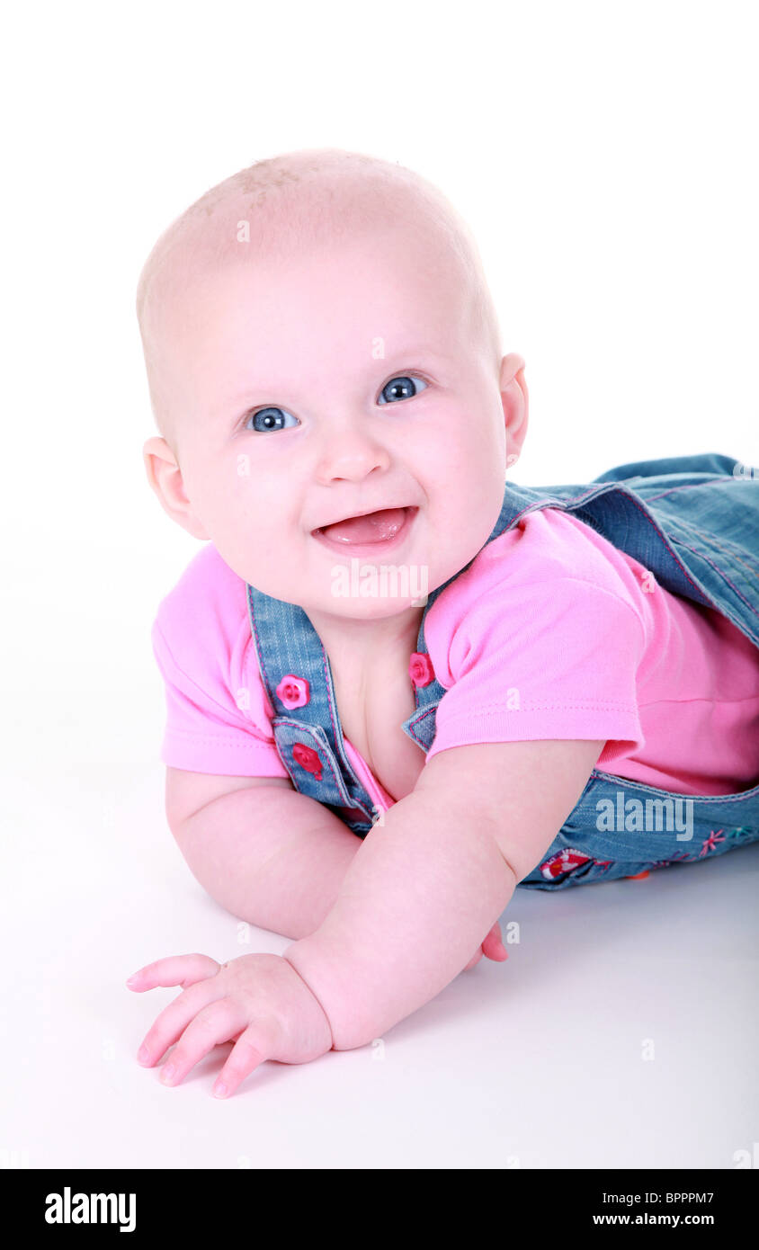 Baby girl learning to crawl Stock Photo - Alamy