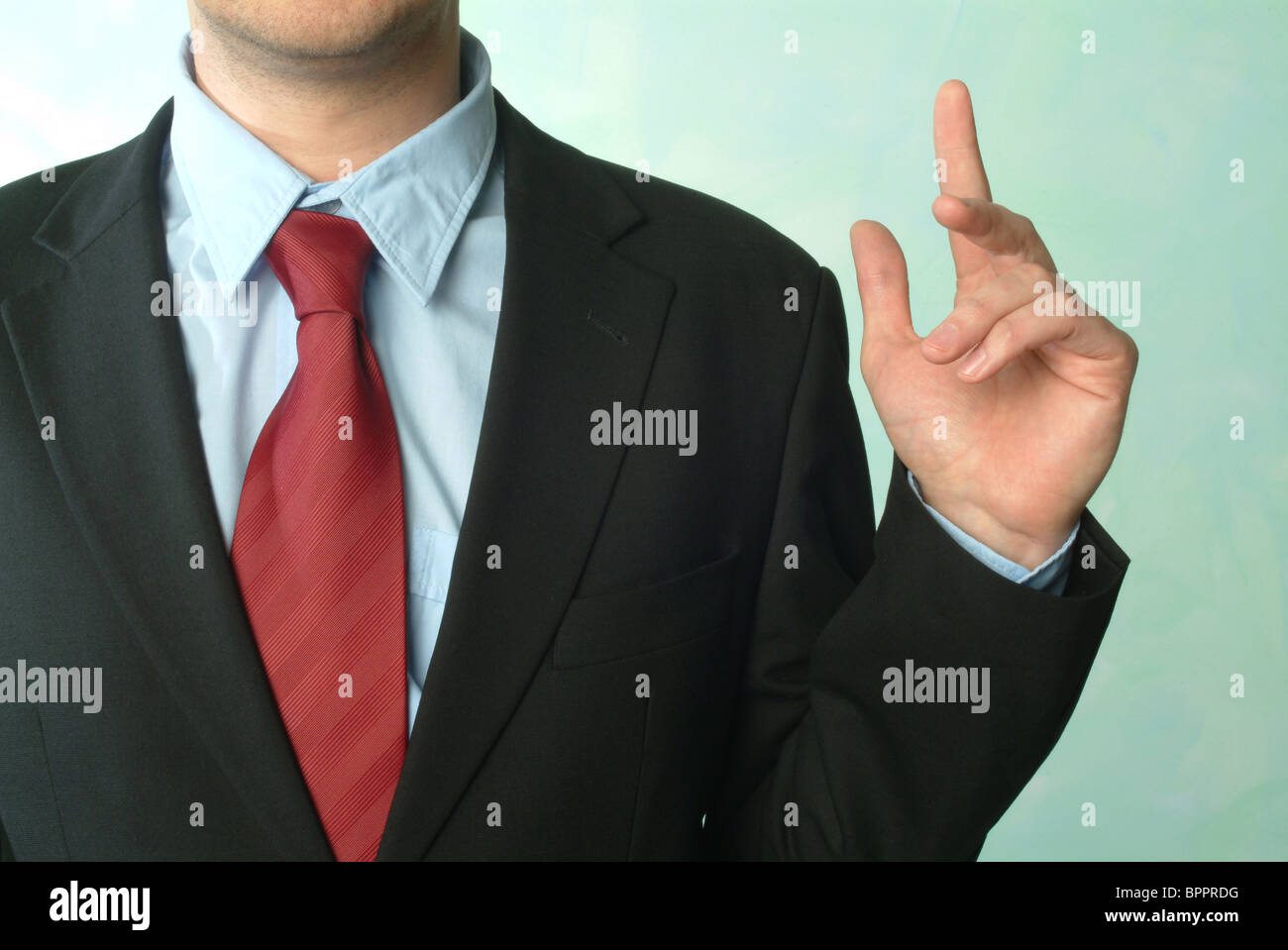 A man raising his hand Stock Photo - Alamy