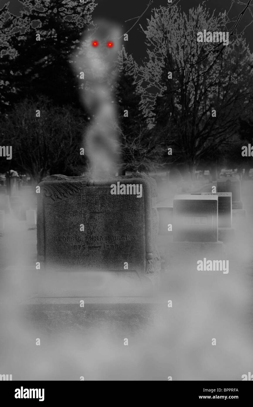 A demonic ghost rises from a grave stone in a foggy cemetery at night ...