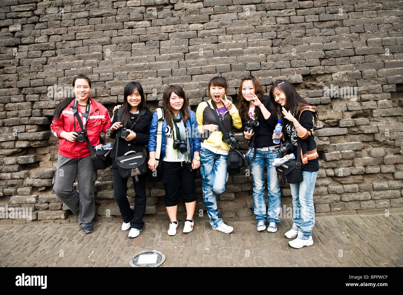 Chinese photographers pose for a group shot at the annual Ping Yao ...