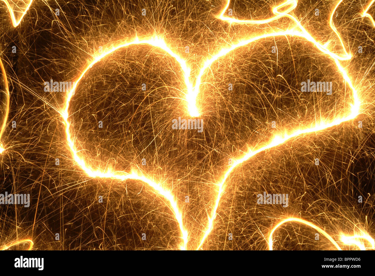 A glowing heart made of sparklers Stock Photo - Alamy