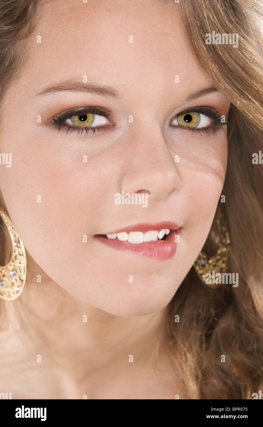 Head shot of Teenager Biting Lower Lip Stock Photo - Alamy