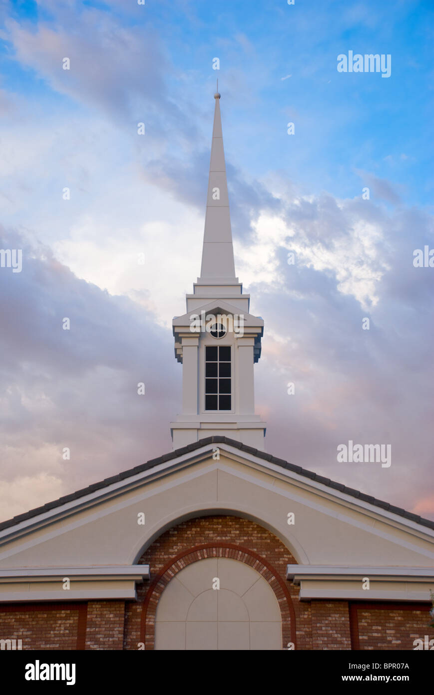 White Spire on Church Building with Dramatic Sky Stock Photo - Alamy