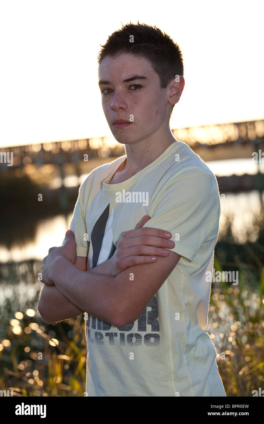 Teenage boy looking moody Stock Photo - Alamy
