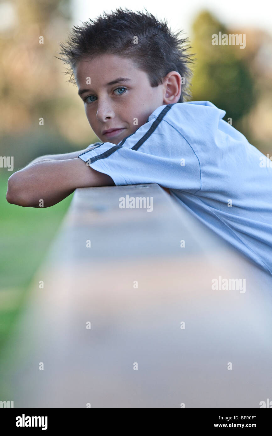 Teenage boy looking bored and angry Stock Photo - Alamy
