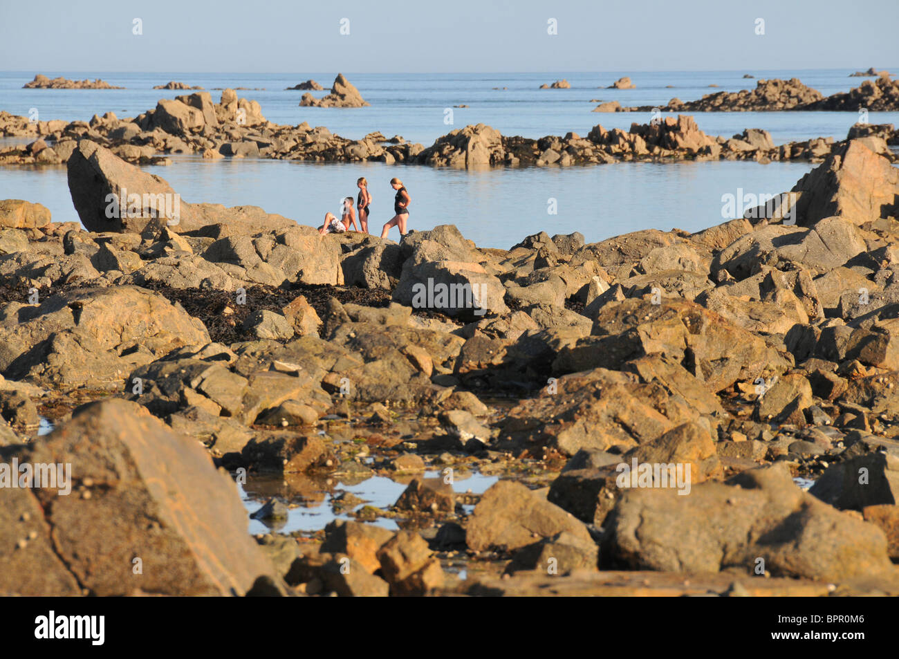 Children on rocks, Jersey Stock Photo - Alamy