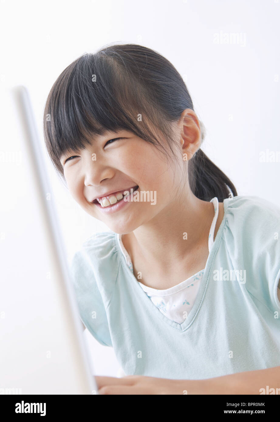 Girl studying with a laptop computer Stock Photo - Alamy