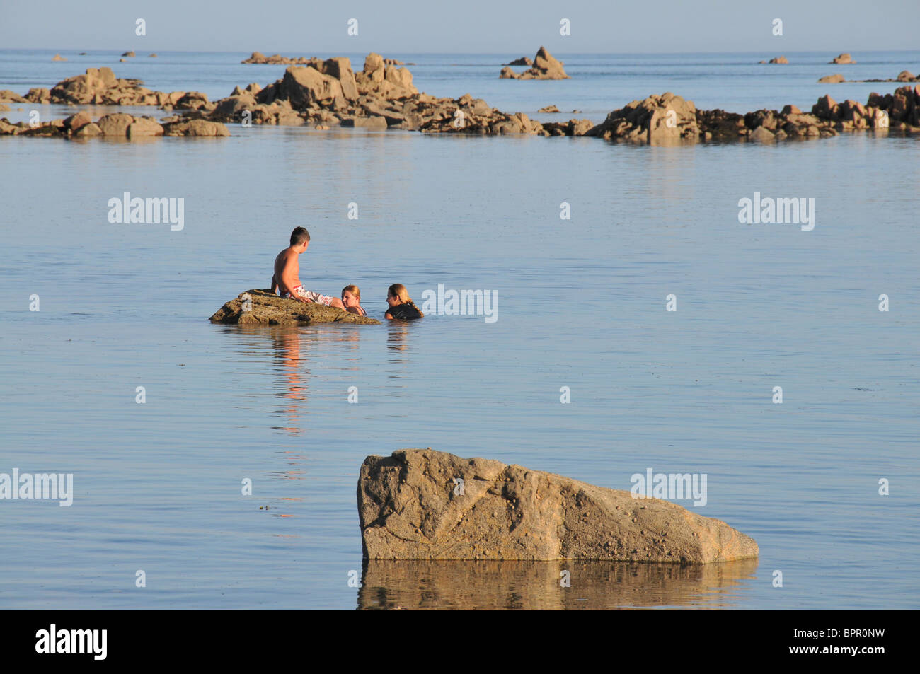 Children on rocks hi-res stock photography and images - Alamy