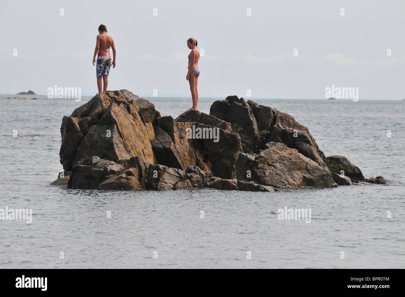 Children on rocks, Jersey Stock Photo - Alamy