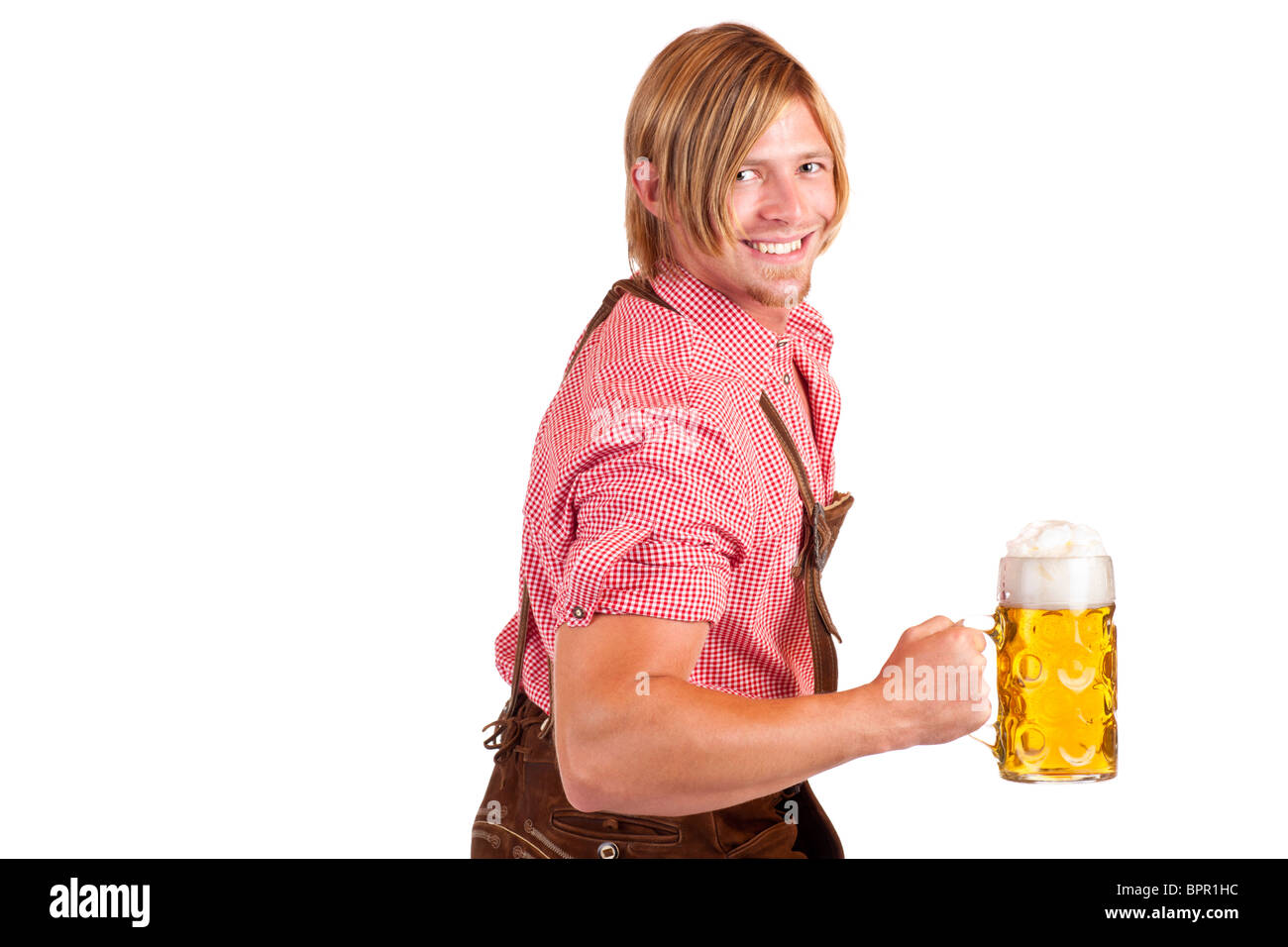 Bavarian man shows biceps muscles and holds Oktoberfest beer stein ...