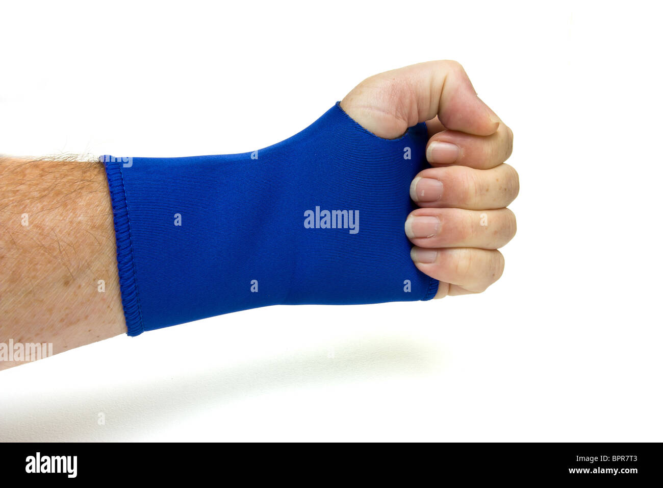 Male hand gesturing wearing blue neoprene wrist support over white ...