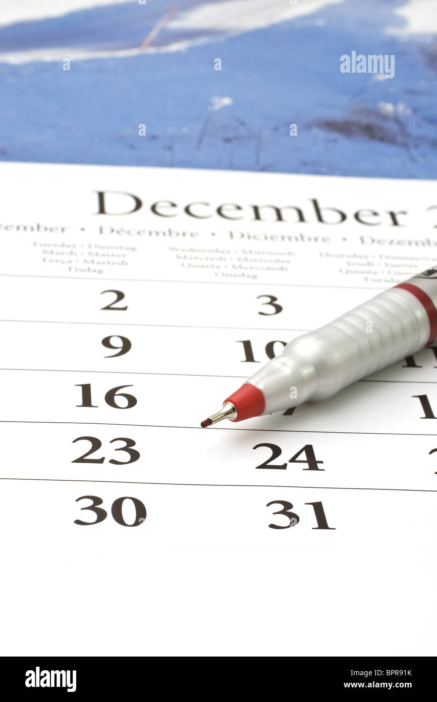 Red pen on a calendar of December Stock Photo - Alamy