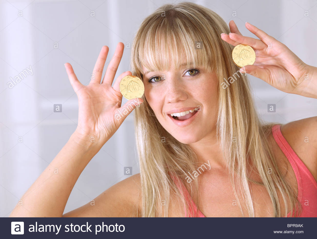 Woman Holding Gold Coins High Resolution Stock Photography and Images ...