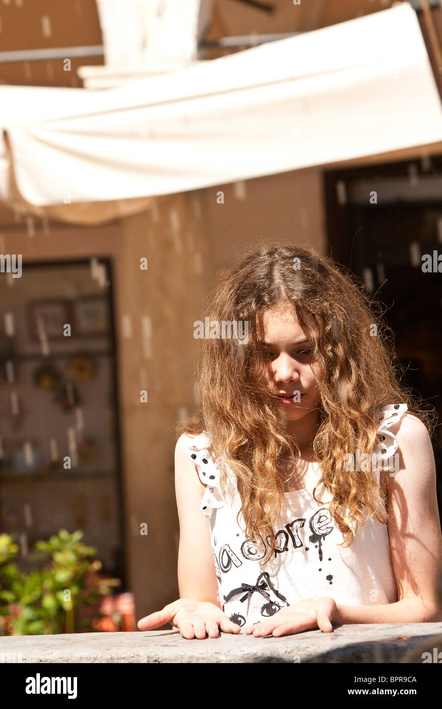 young girl cooling off by fountain in Italy Stock Photo - Alamy