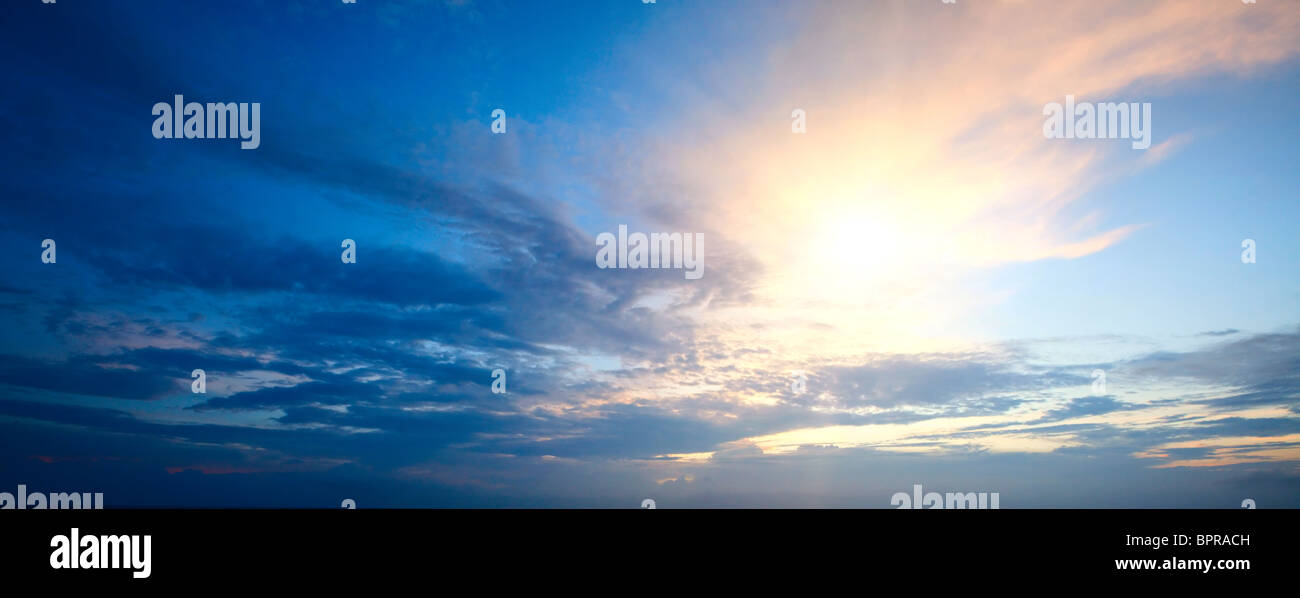 Sunset sky with sun Stock Photo - Alamy