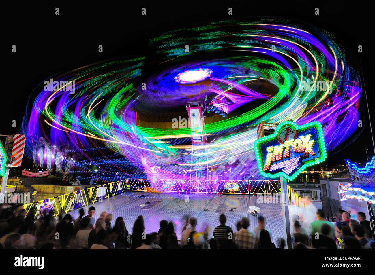 Long-exposure of a fairground ride against the night sky Stock Photo ...
