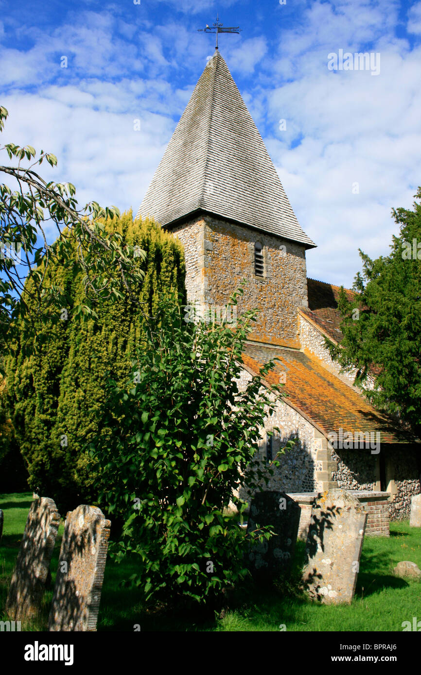 St Peter church in Rodmell with its square tower, pyramidal cap and ...