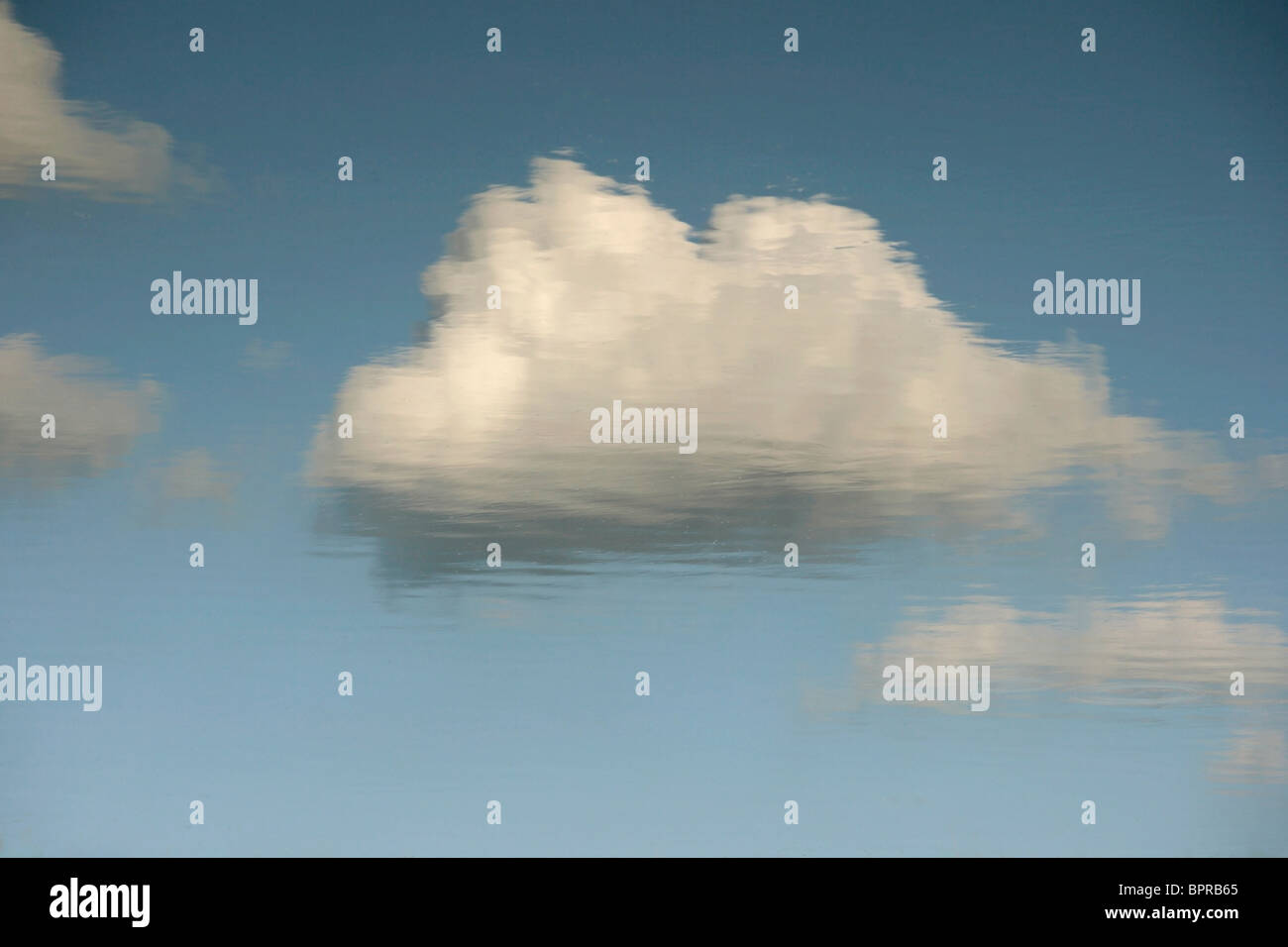 Reflected clouds in water Stock Photo - Alamy