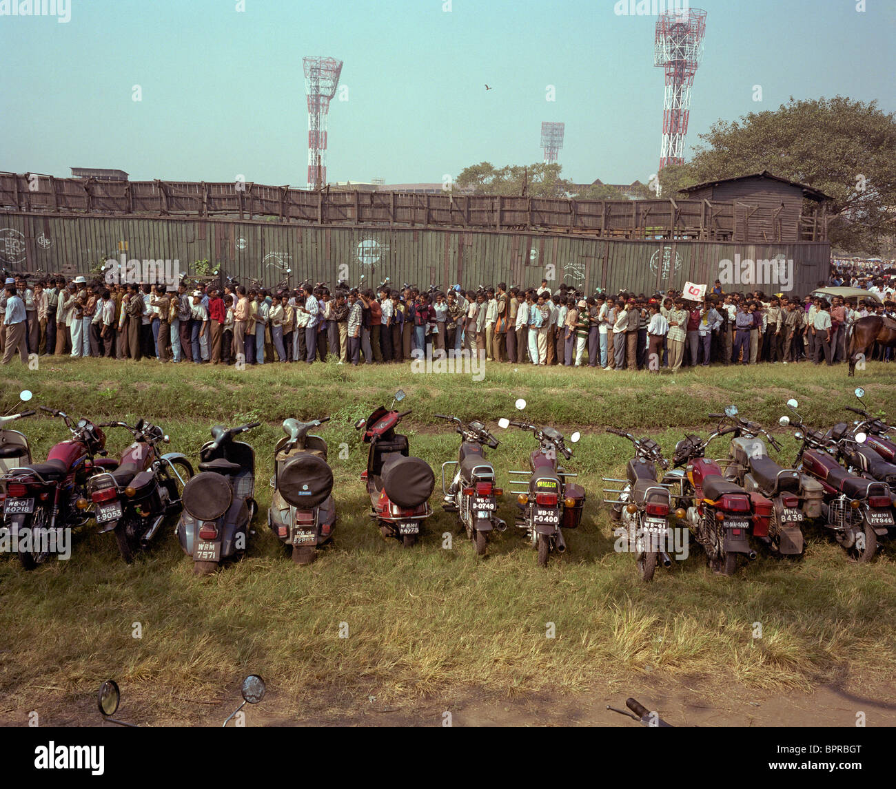 Cricket sports fans queue patiently outside a game venue in Kolkata ...