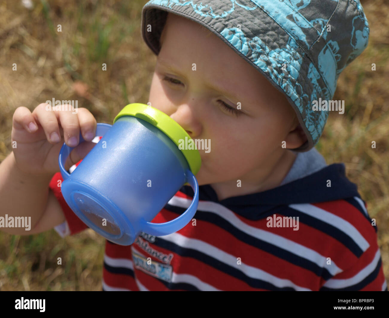 child drinking from cup Stock Photo - Alamy