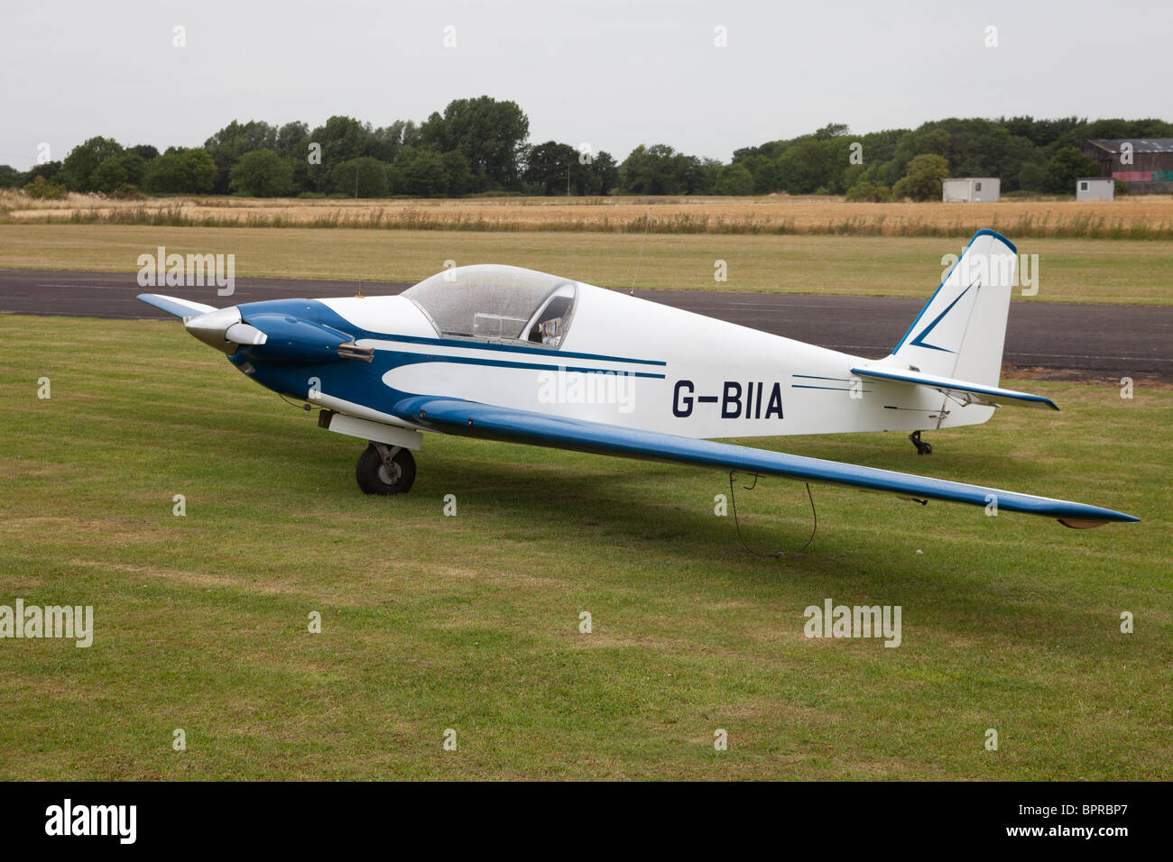 Fournier RF3 G-BIIA parked on the grass at Breighton Airfield covered ...