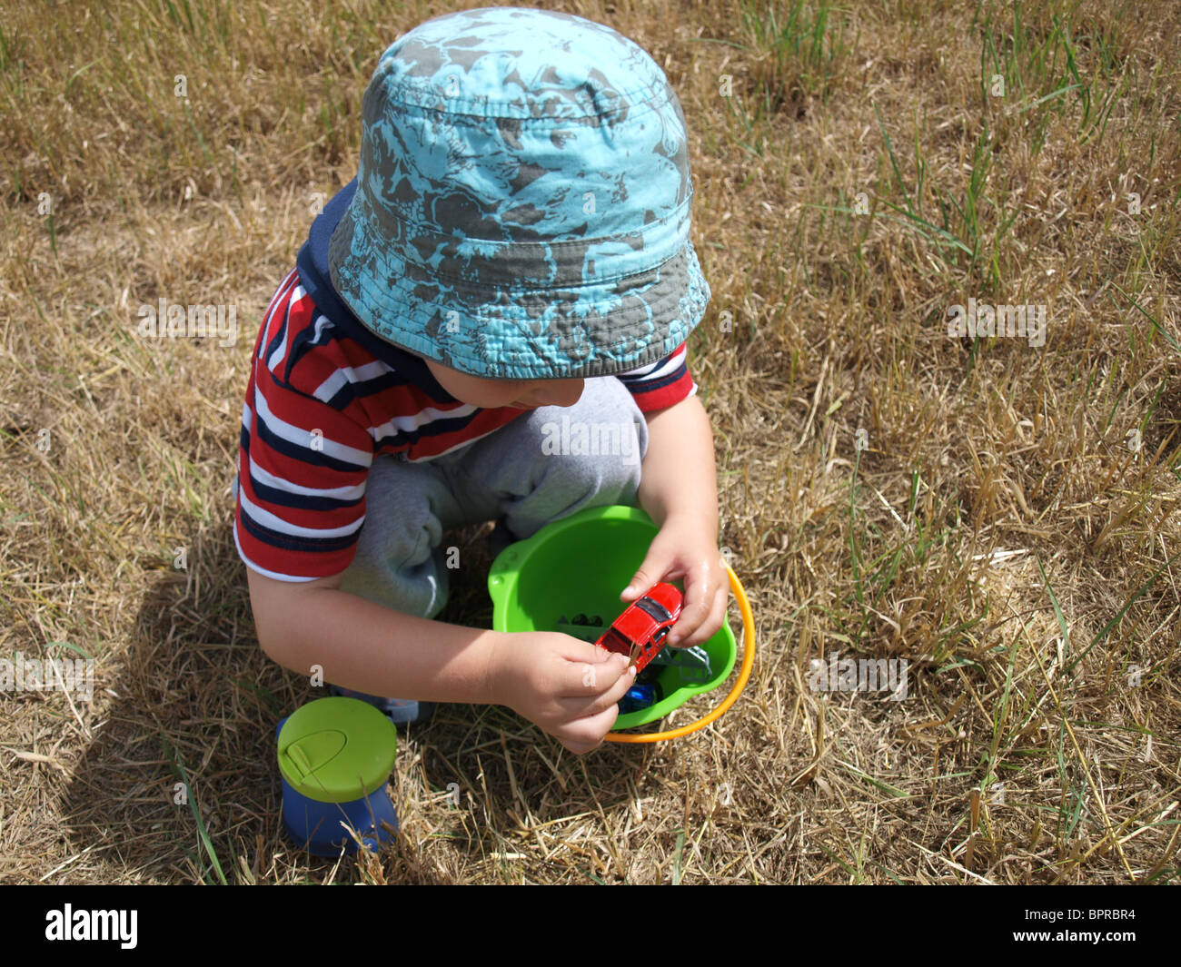 little boy playing with his toys Stock Photo - Alamy