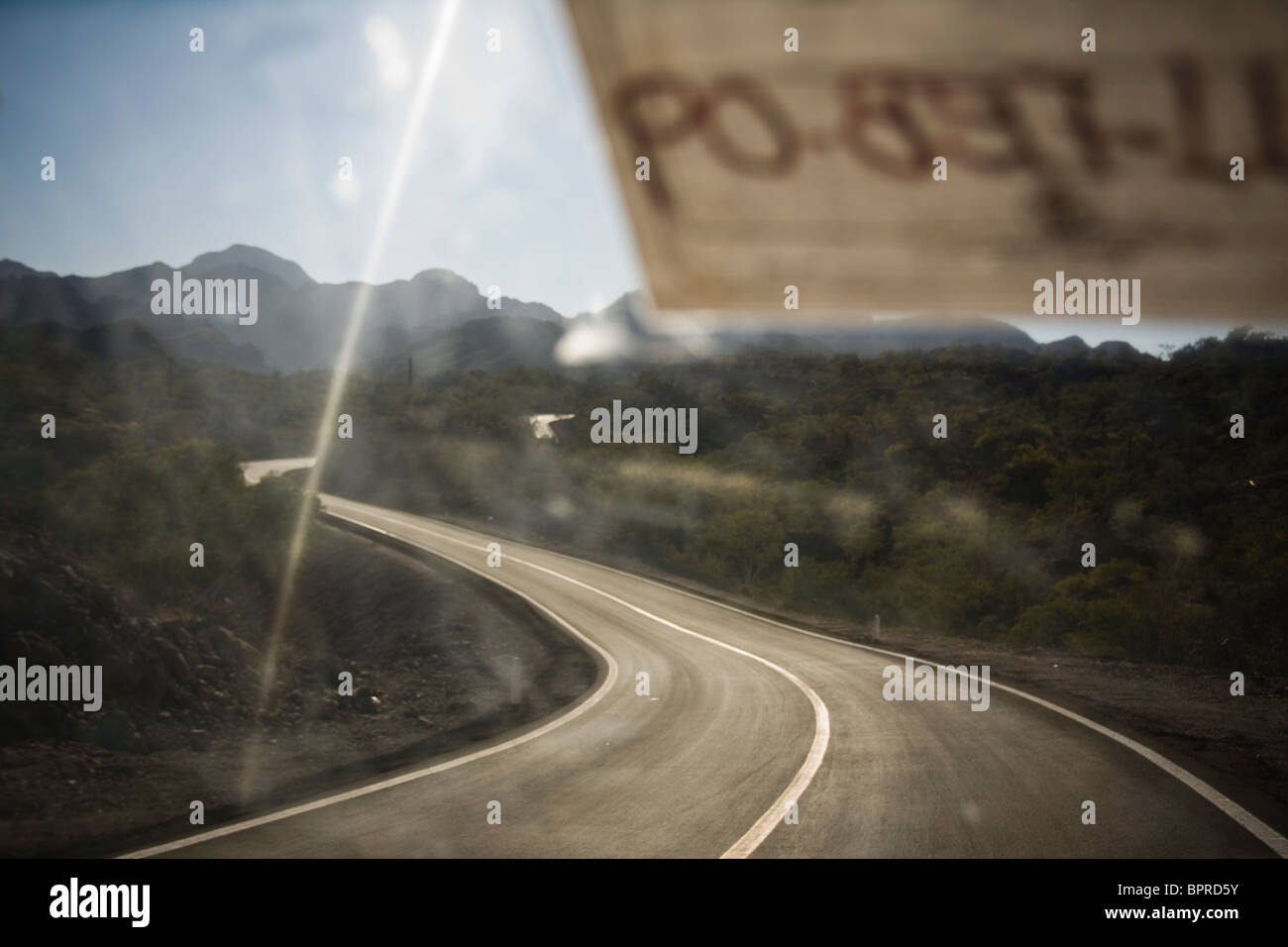 A paved road winds through the Sierra de Giganta, Baja California ...