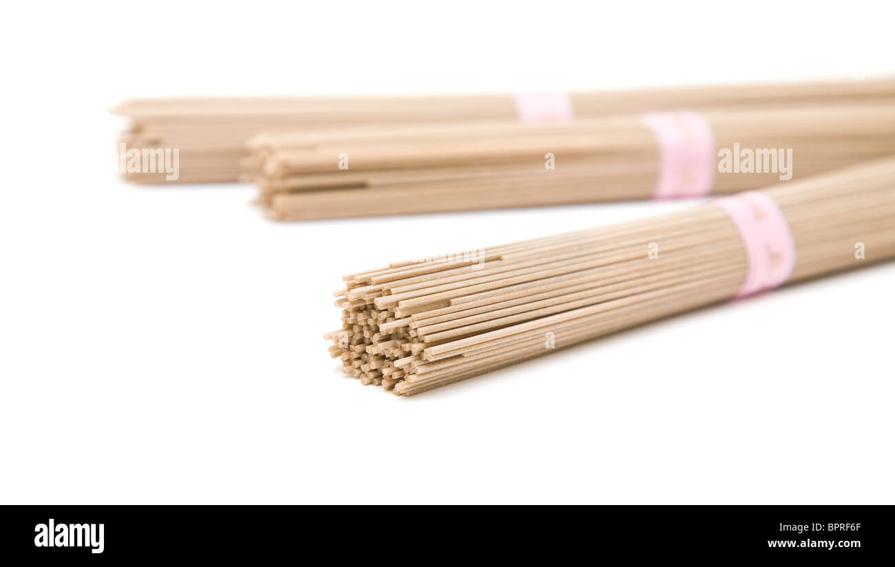 Three bundles of Japanese buckwheat soba noodle; isolated on white ...