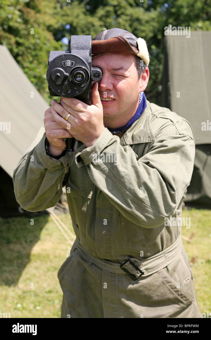 WW2 Reenactment Member in the US Army using a clockwork cine camera ...