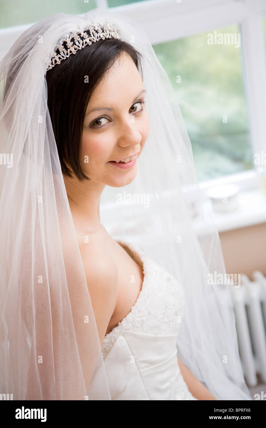 Beautiful young bride smiling Stock Photo - Alamy
