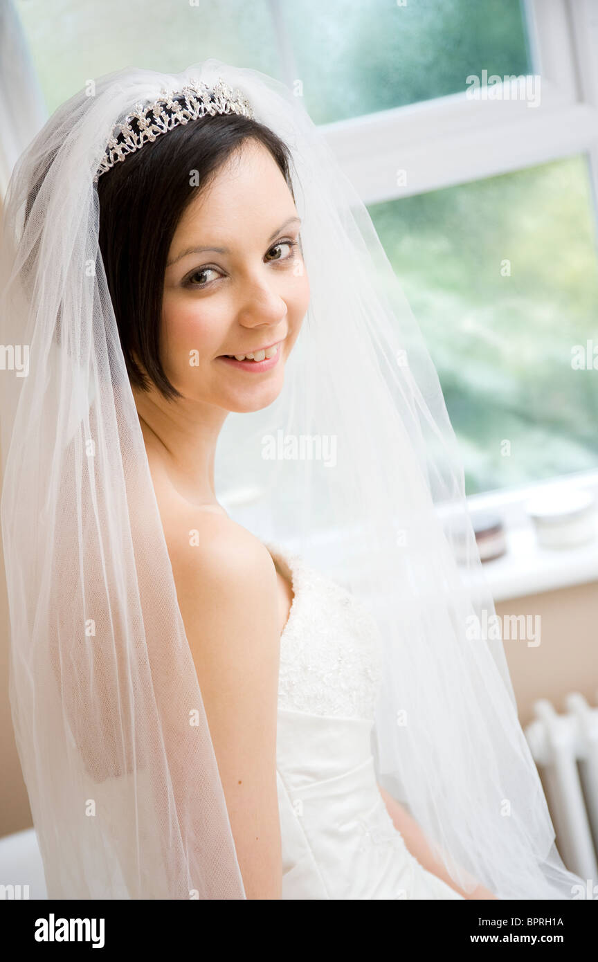 Beautiful young bride smiling Stock Photo - Alamy