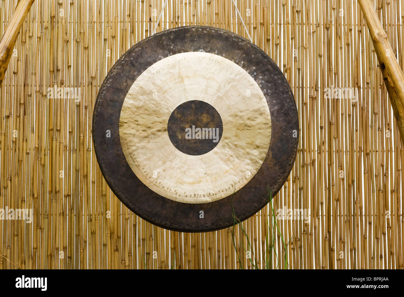 Traditional oriental gong on bamboo mat, front view Stock Photo - Alamy