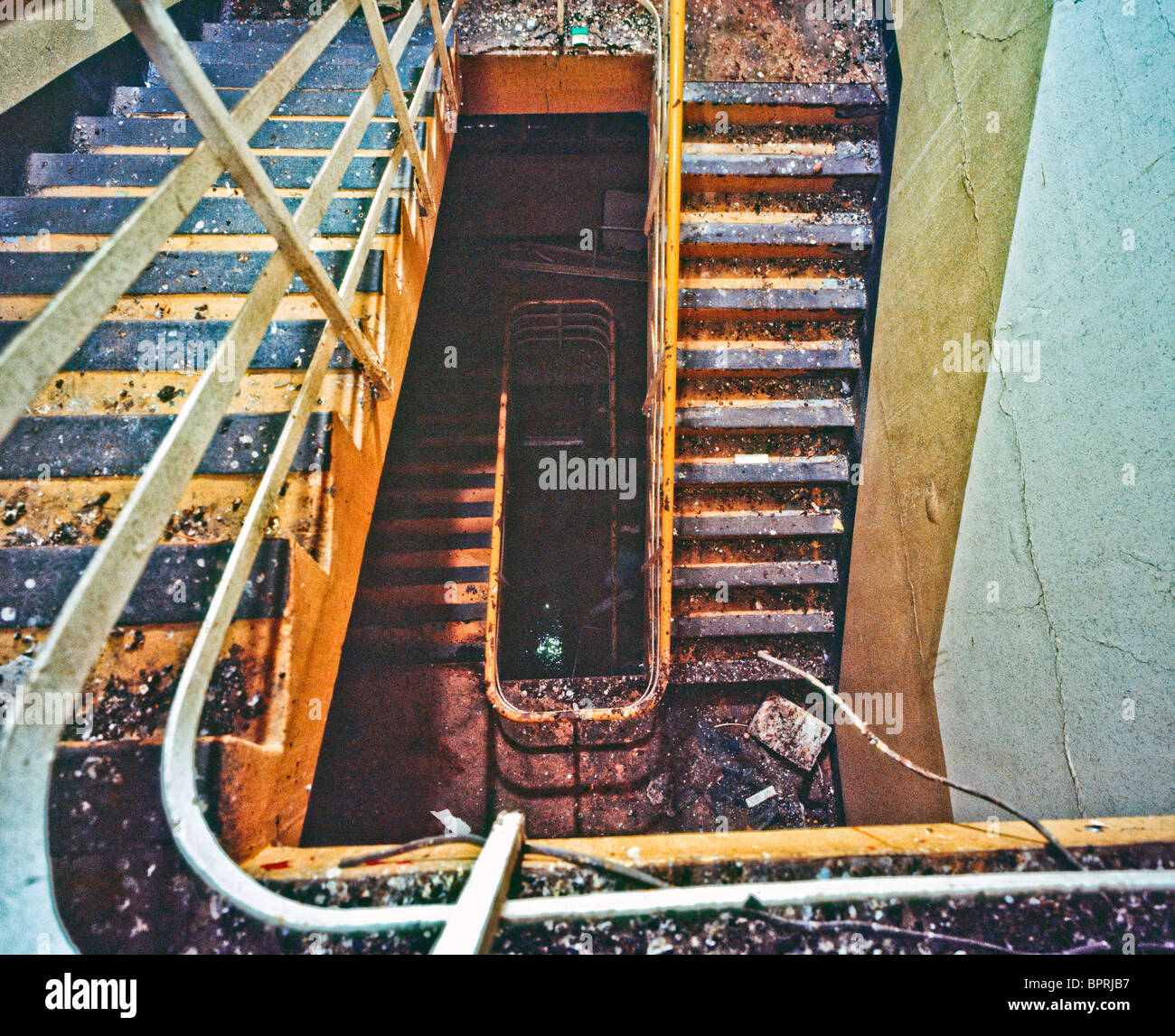 stairway in grimy derelict factory abm Stock Photo - Alamy