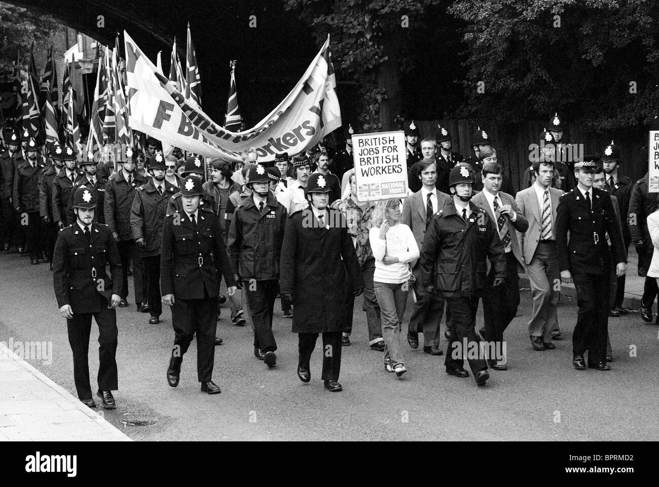 Police officers escort National Front march at Nuneaton Sunday August ...