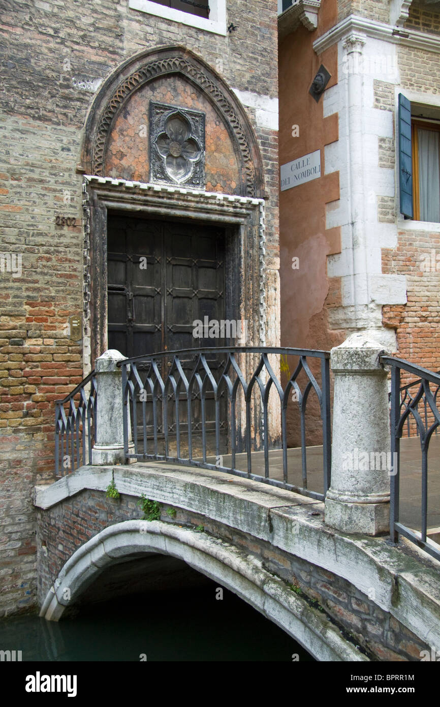 Decorative Venetian door and bridge Stock Photo - Alamy