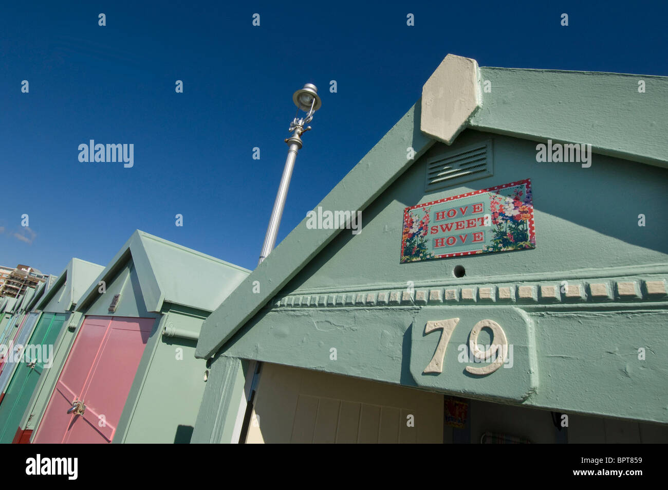 Hove beach hut 79 decorated with a "Hove Sweet Hove" sign Stock Photo ...