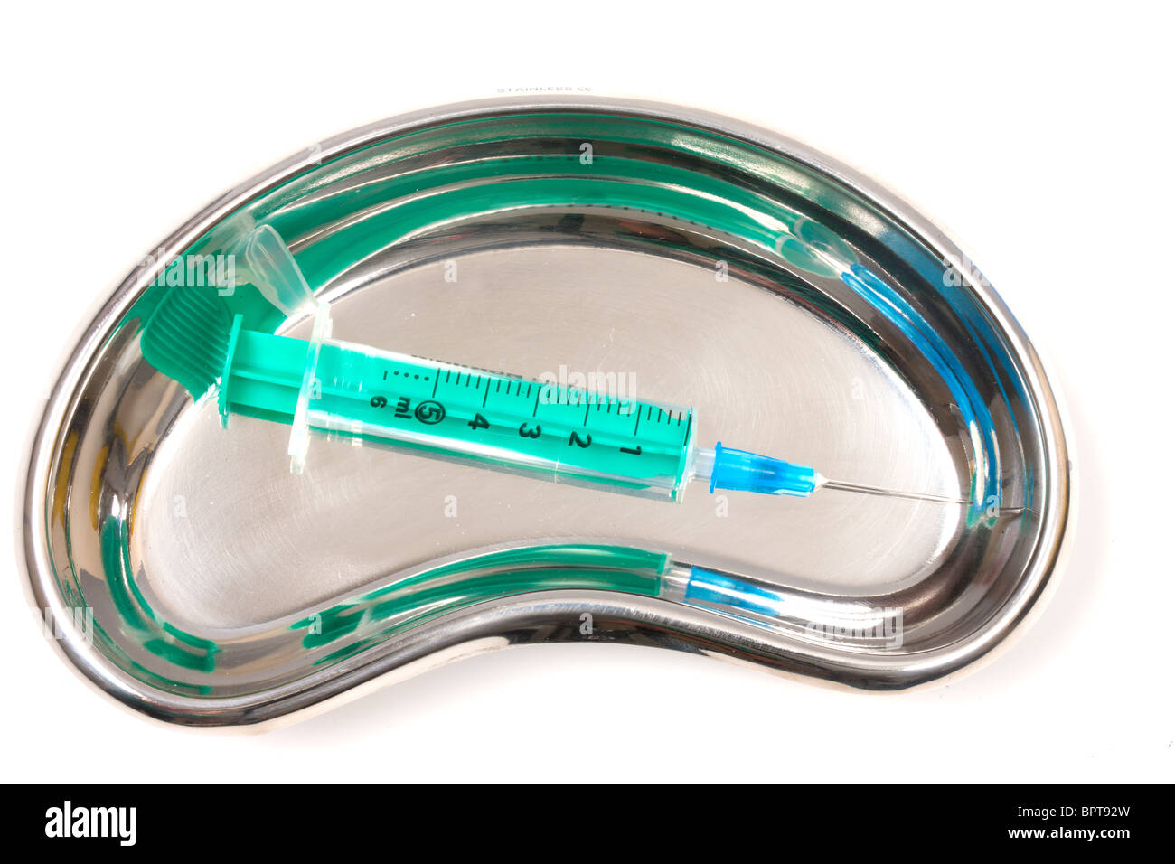 Green Syring in a stainless steel kidney dish Stock Photo - Alamy