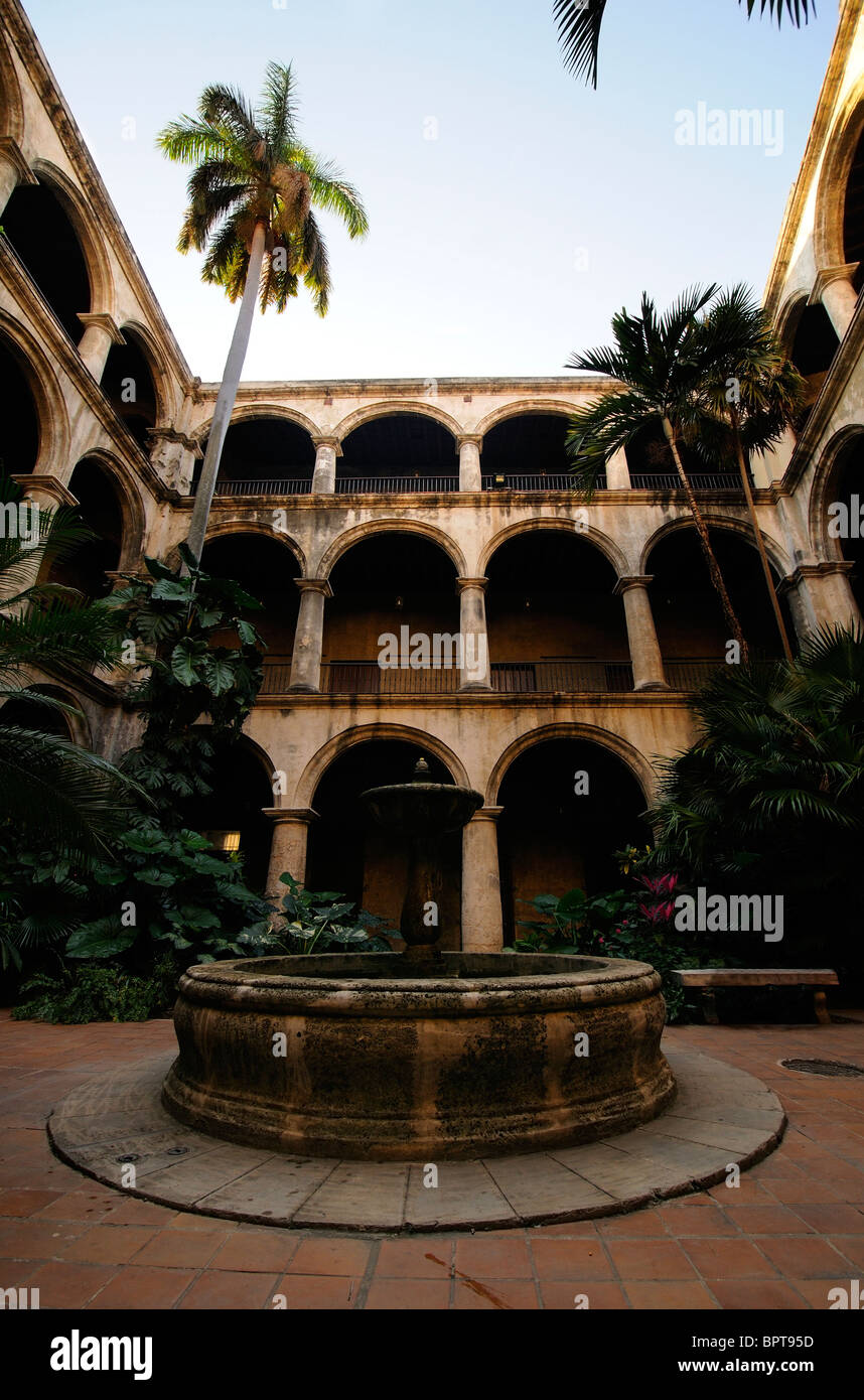 Old Havana building interior with fountain and tropical vegetation ...