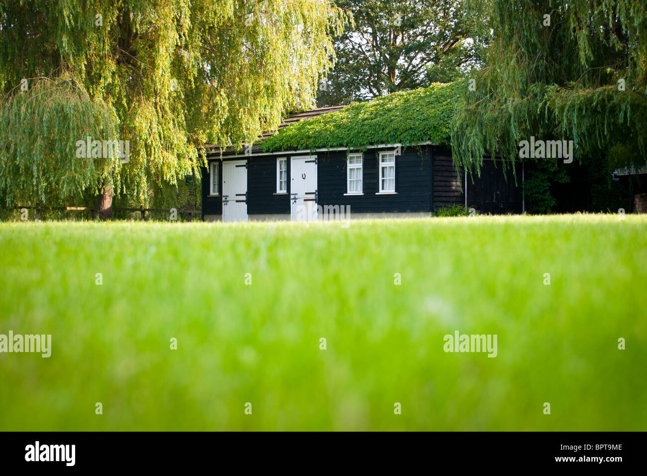 A two berth stable in a lush countryside paddock Stock Photo - Alamy