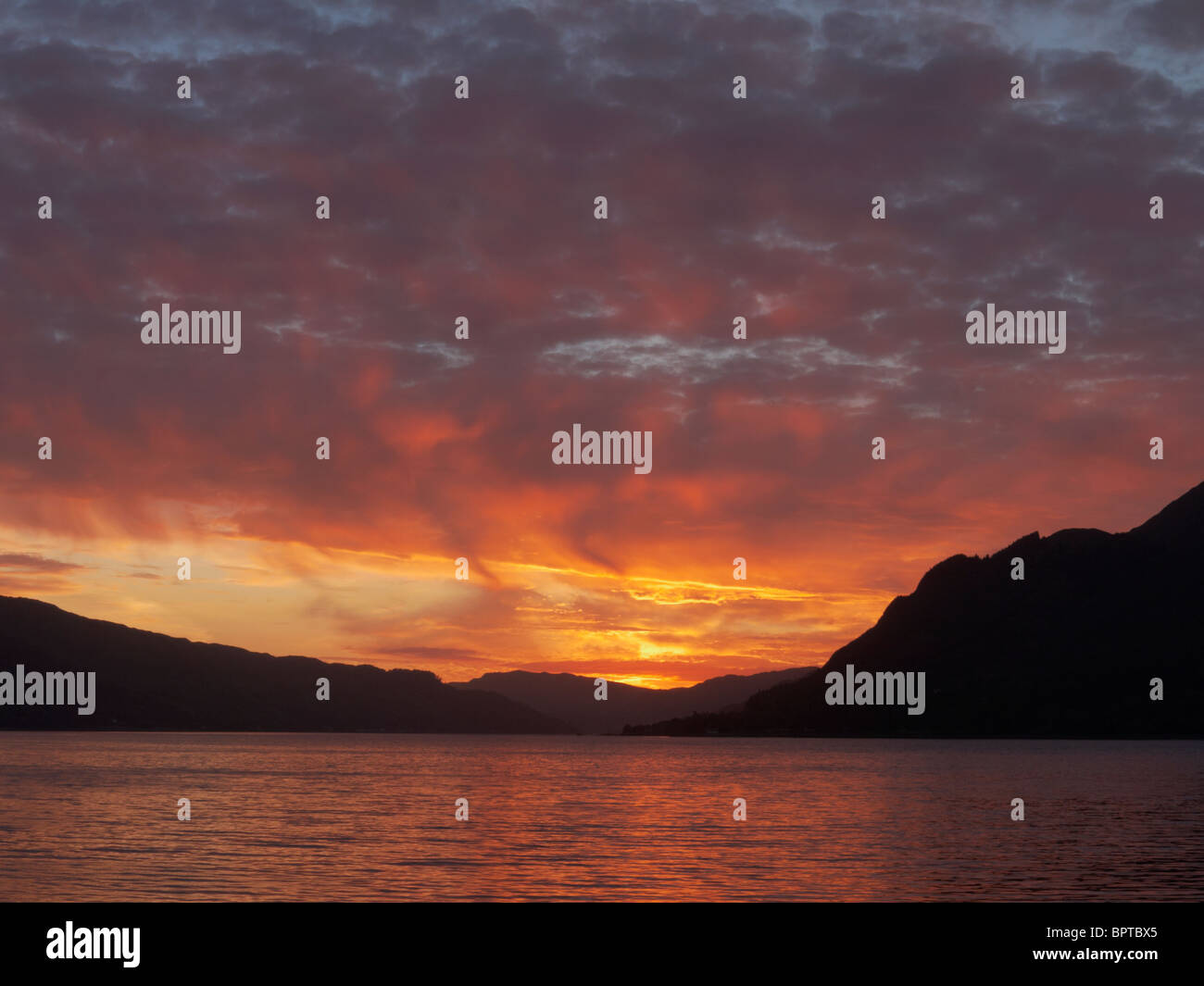 Sunlit clouds over water at sunset hi-res stock photography and images ...
